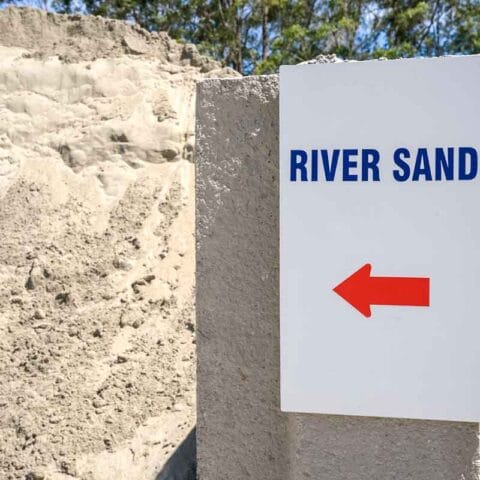 What is river sand and how is it used in gardening?