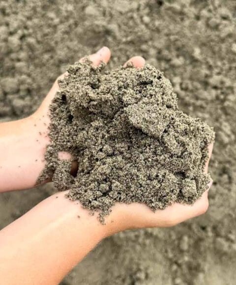 What is river sand and how is it used in gardening?